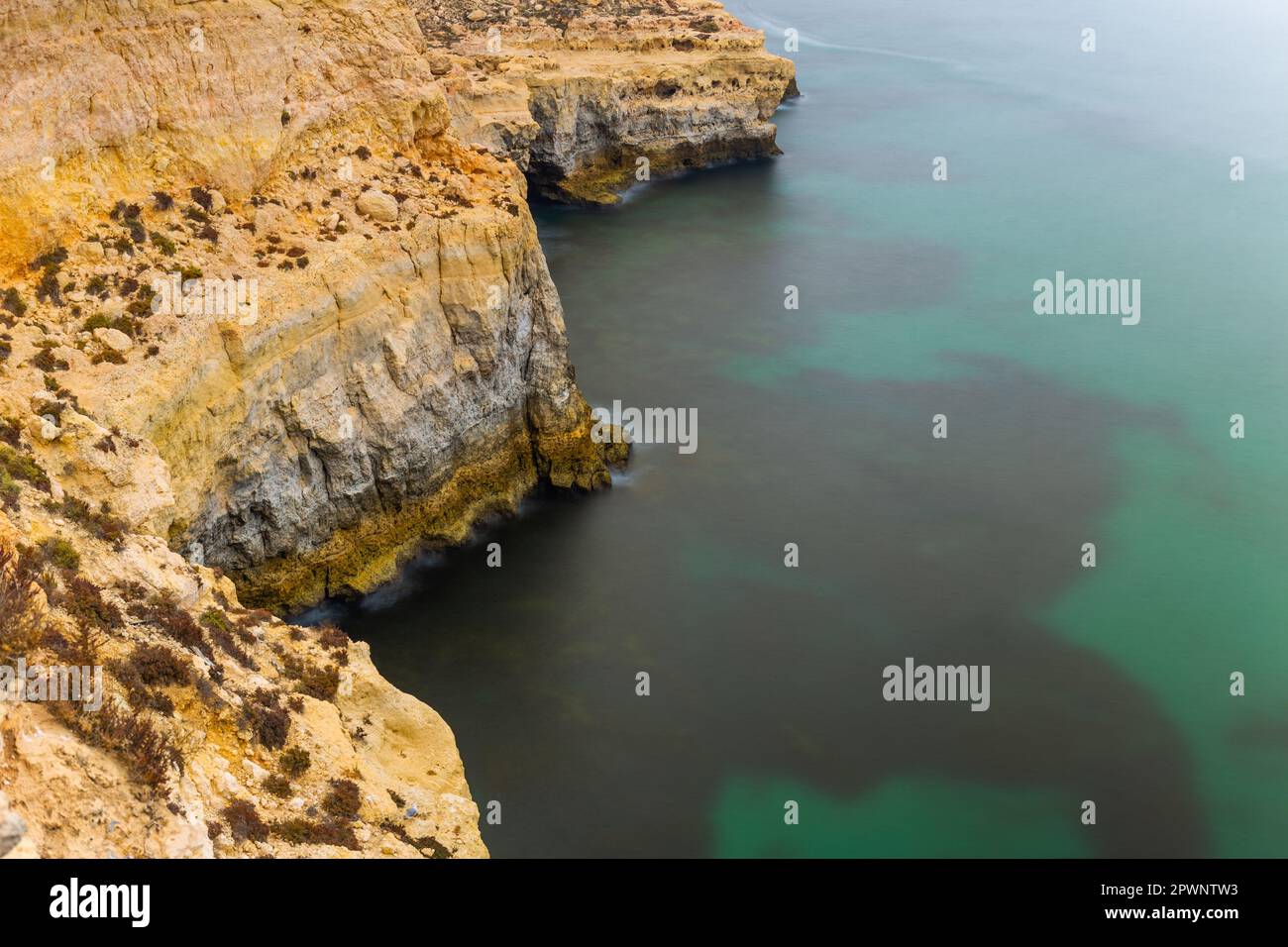 The famous coastline of Algarve in Portugal with Sandstone Cliffs ...