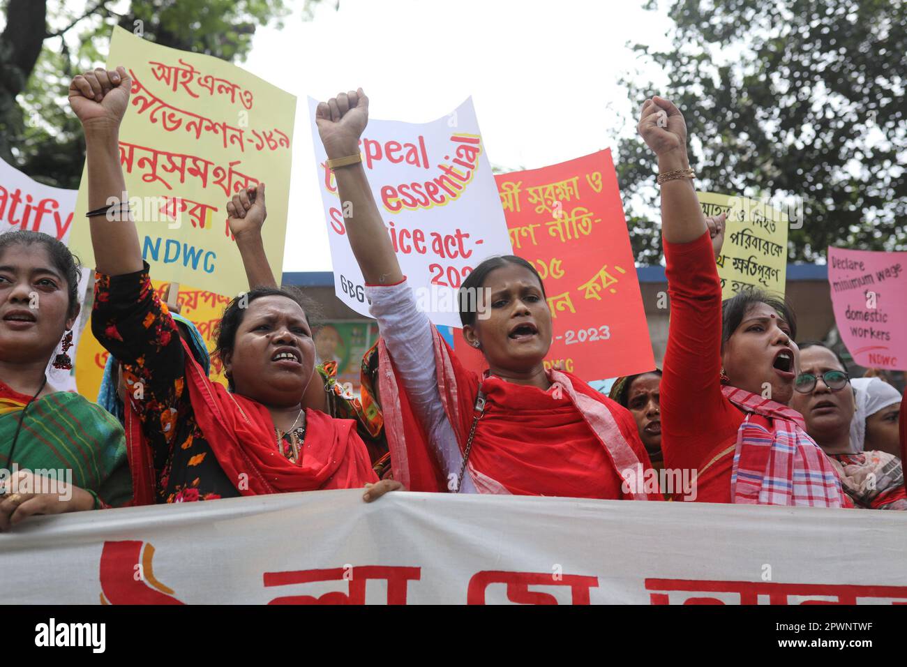 DHAKA, BANGLADESH - MAY 1: Bangladeshi garment workers and other labor ...