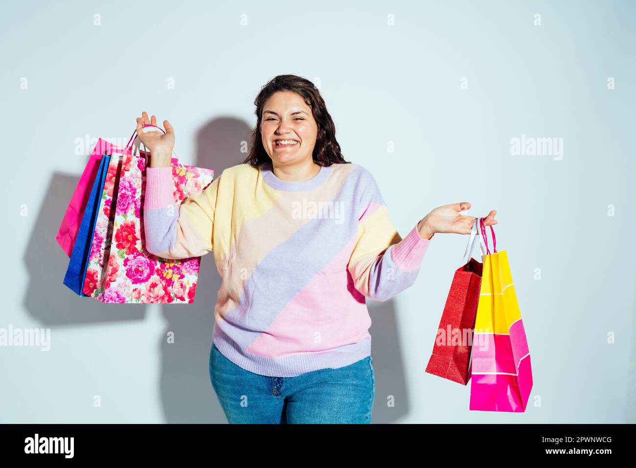 Plus size woman model posing in studio and having fun. Shots taken on ...