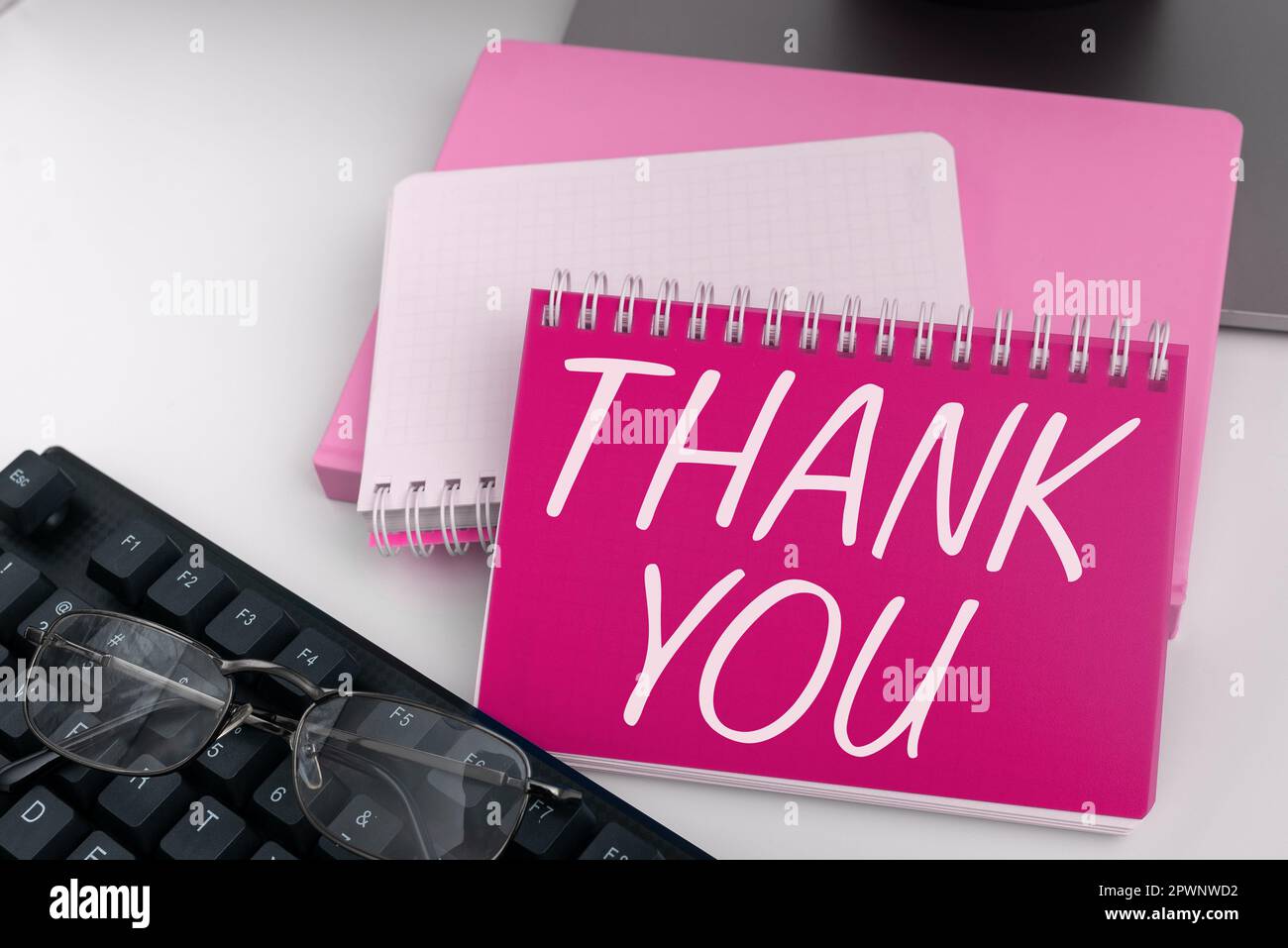 Hand writing sign Thank You, Business approach replaying on something ...