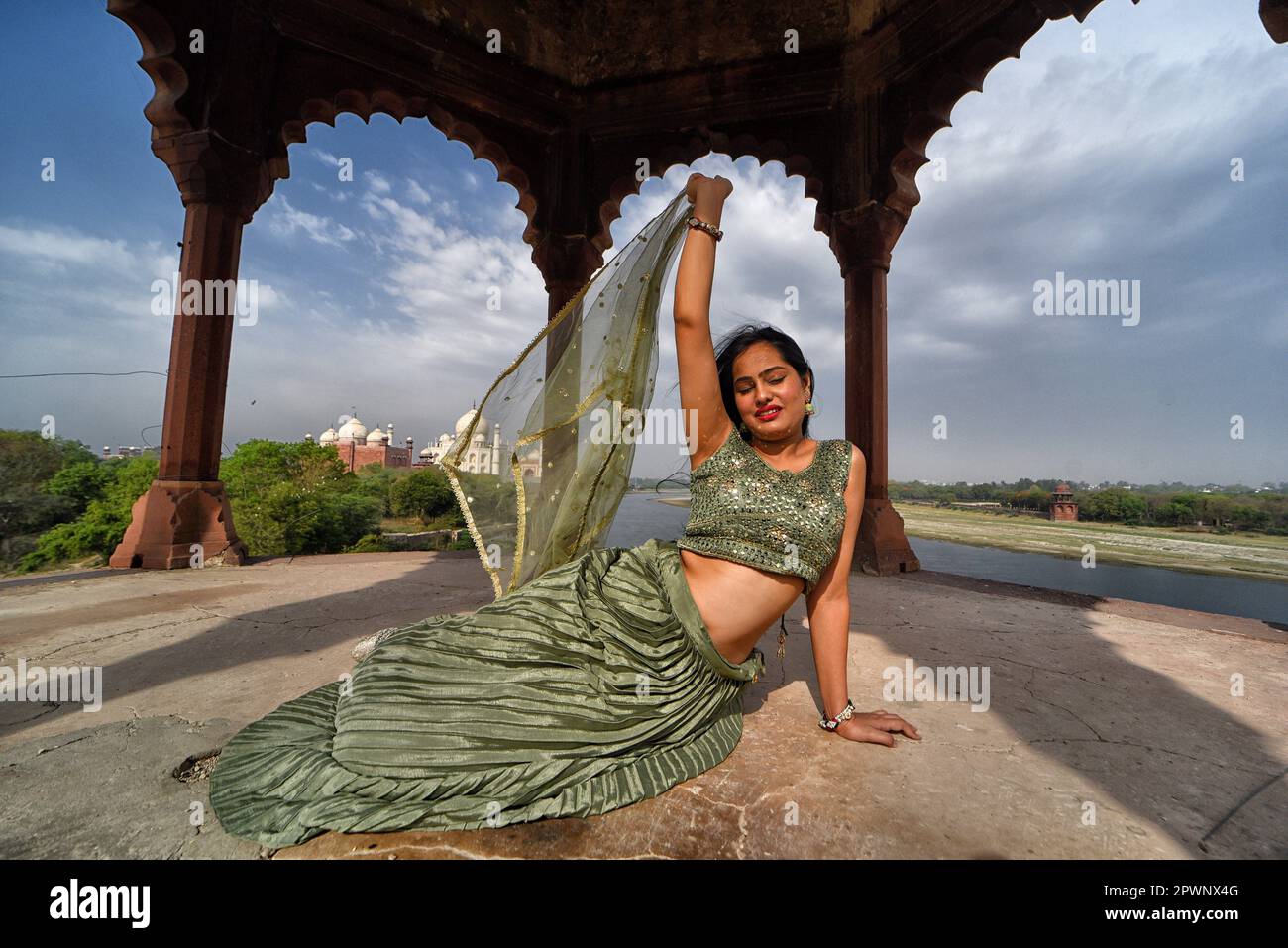 Agra, India. 23rd Apr, 2023. Nandini Singh, a female model poses for photos near of the iconic ...
