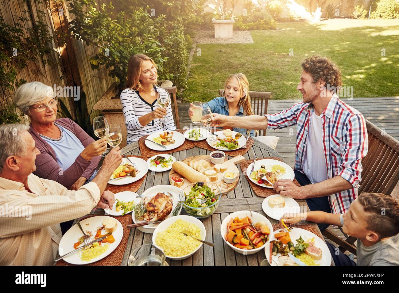 Sunday lunch is the best part of the week. a family eating lunch ...