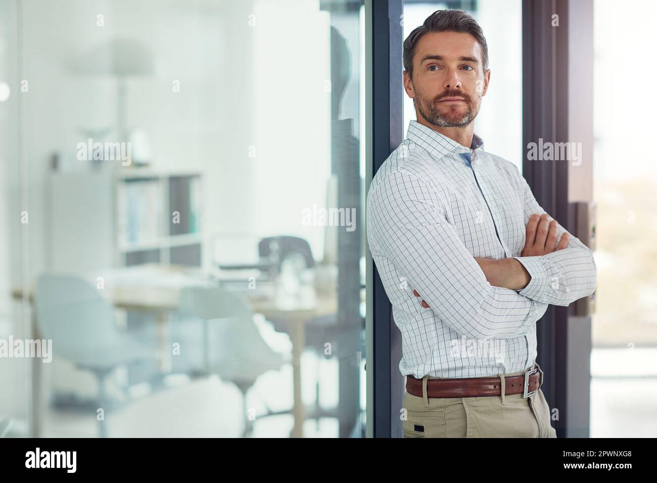 Moving forward with clear visions of his goals. a businessman standing ...