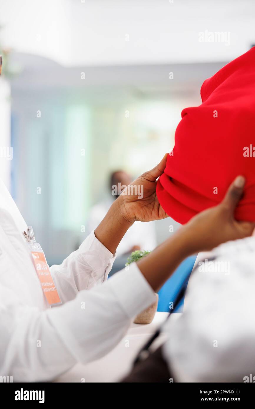 African american woman hands dressing mannequin to showcase fashion ...