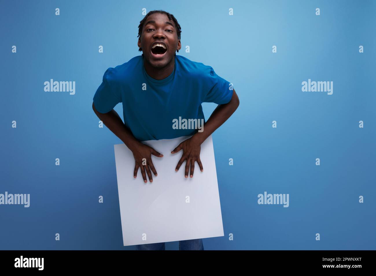 positive african young man with paper placard for notes Stock Photo - Alamy