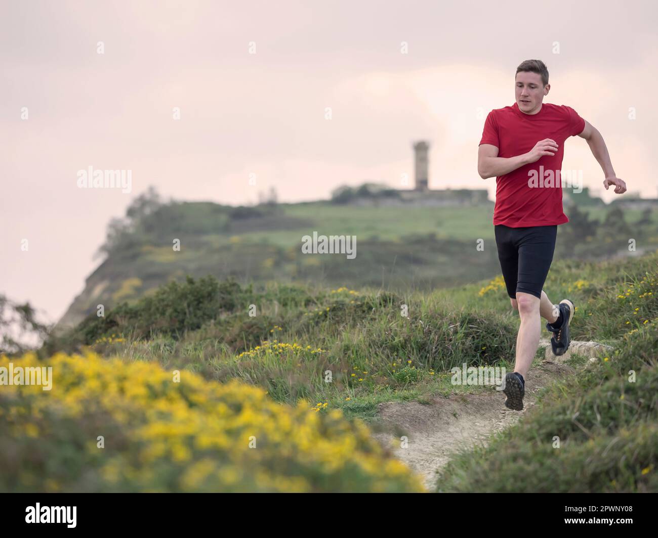 Man trail running on the cliff of Getxo Stock Photo - Alamy