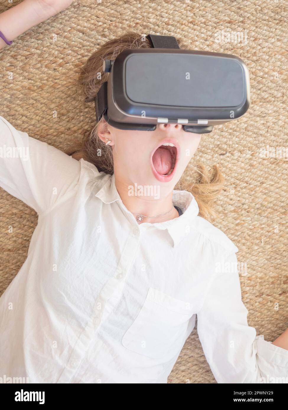 Girl 10 11 lying on floor hi-res stock photography and images - Alamy
