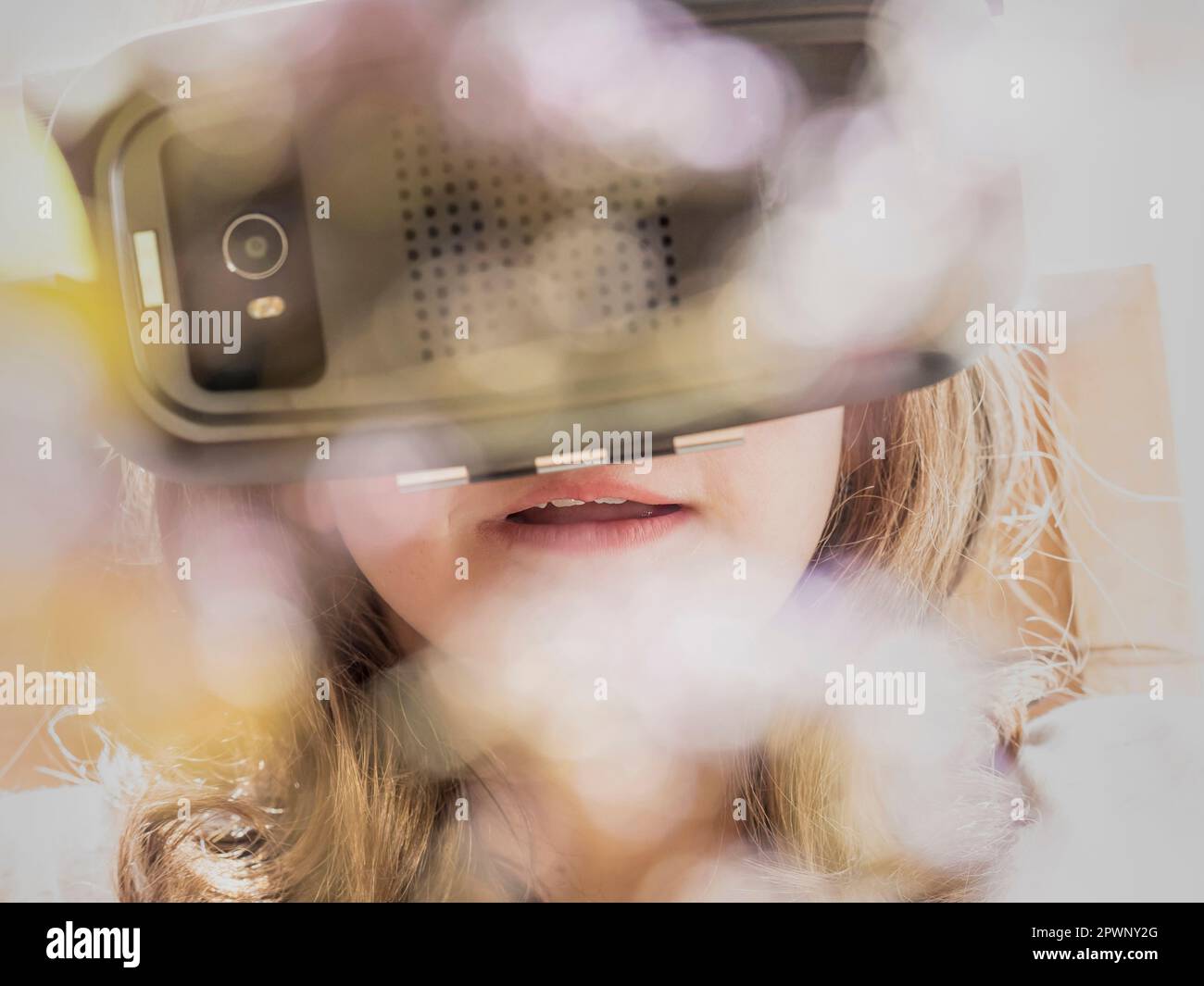 Girl wearing virtual reality glasses Stock Photo - Alamy
