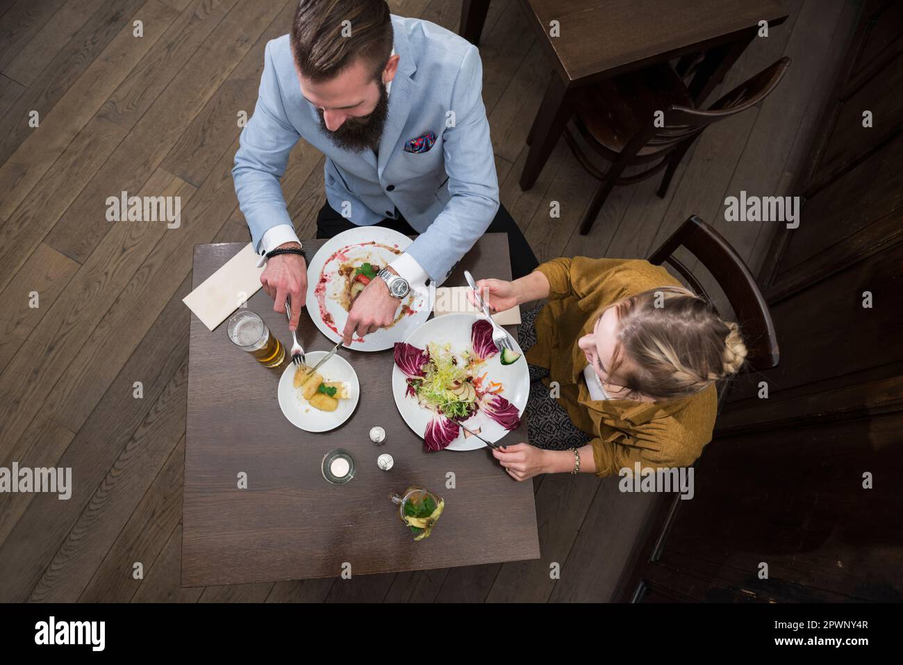Top view of couple eating at restaurant Stock Photo - Alamy