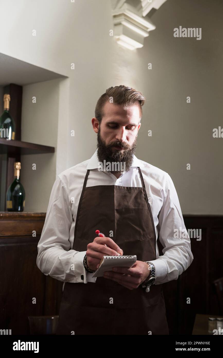 Waiter writing down an order hi-res stock photography and images - Alamy