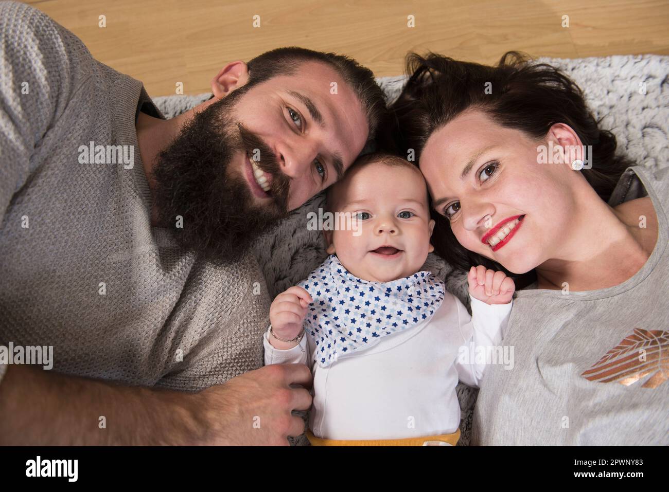 Portrait of parents with baby boy Stock Photo - Alamy