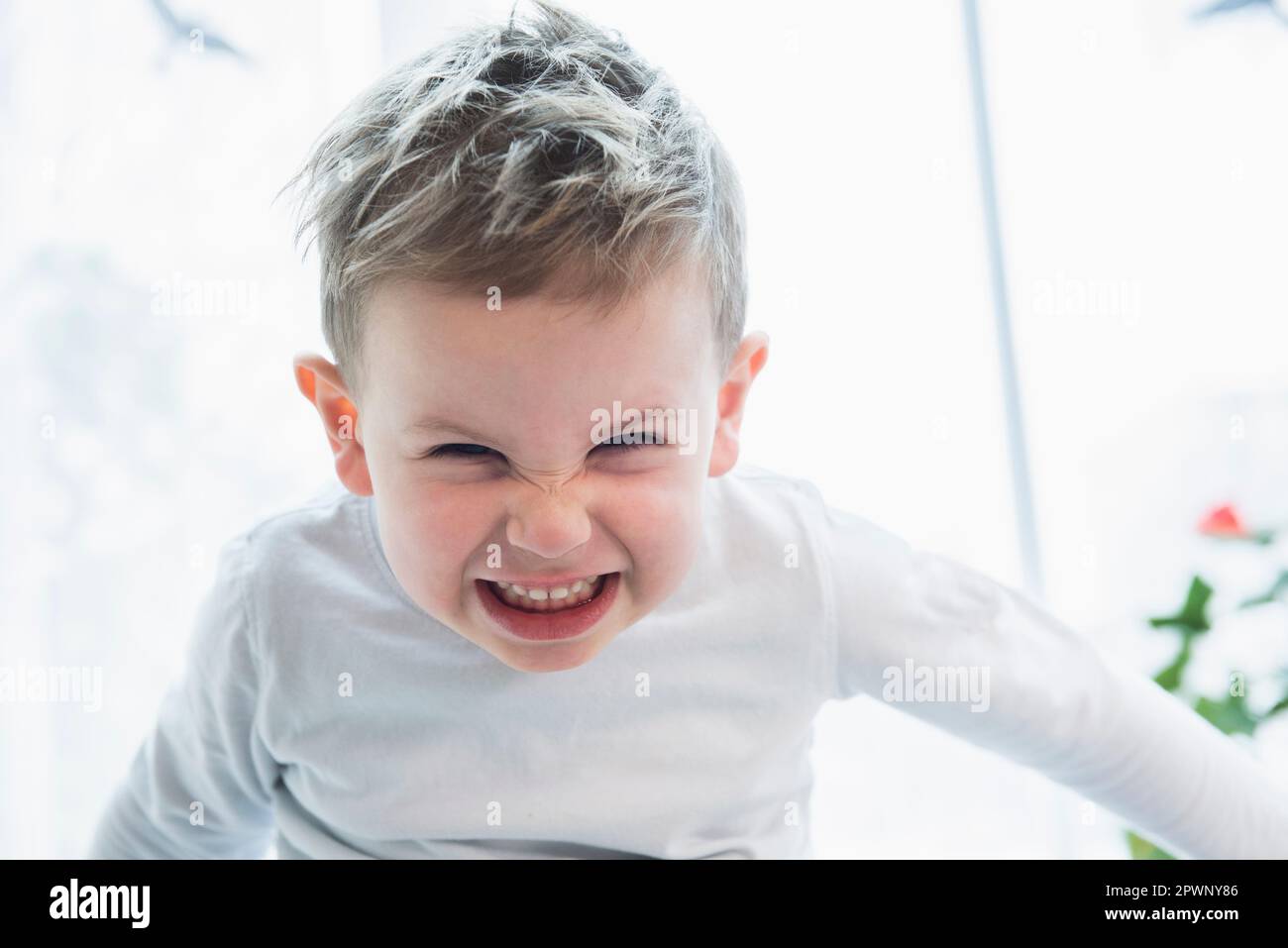 Child boy gritting teeth hi-res stock photography and images - Alamy