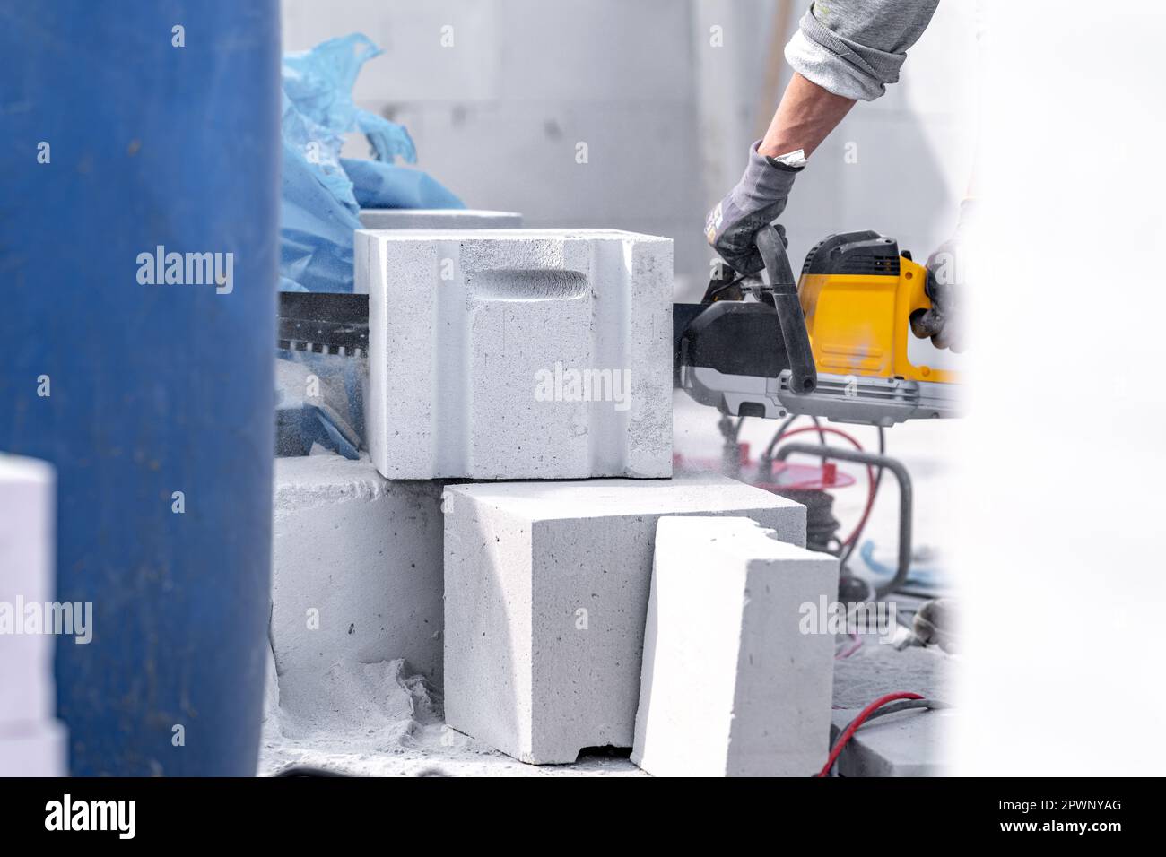 cutting concrete blocks with a saw during the construction of a ...