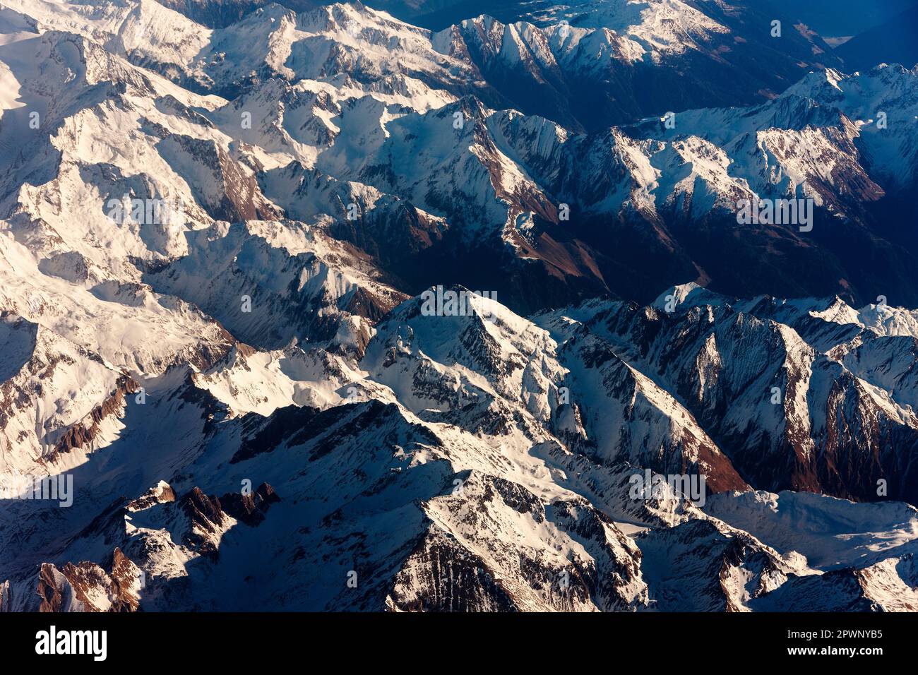 Aerial view of snowcapped mountain range Stock Photo - Alamy