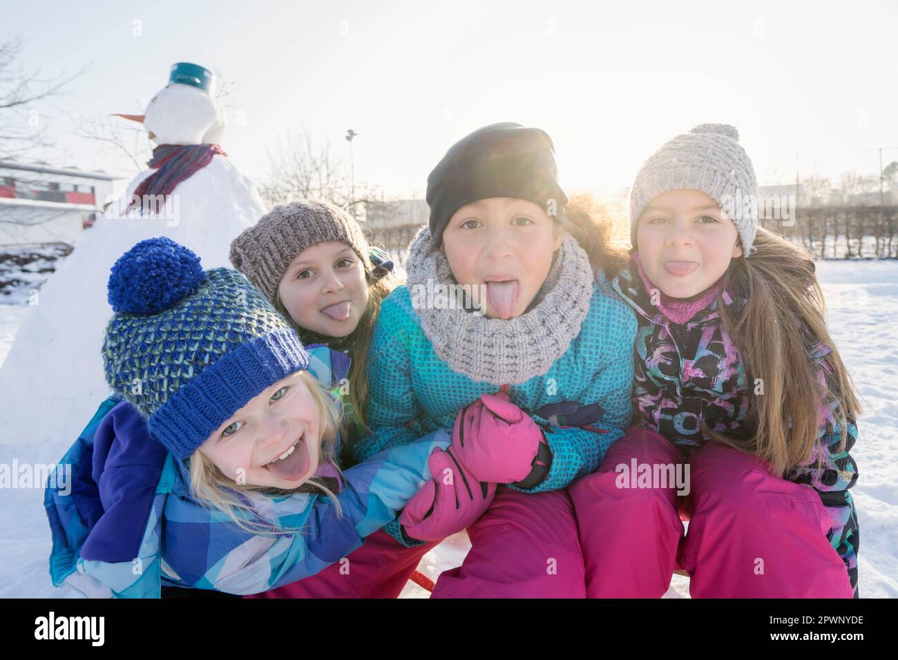 Portrait of children sticking out tongue Stock Photo - Alamy