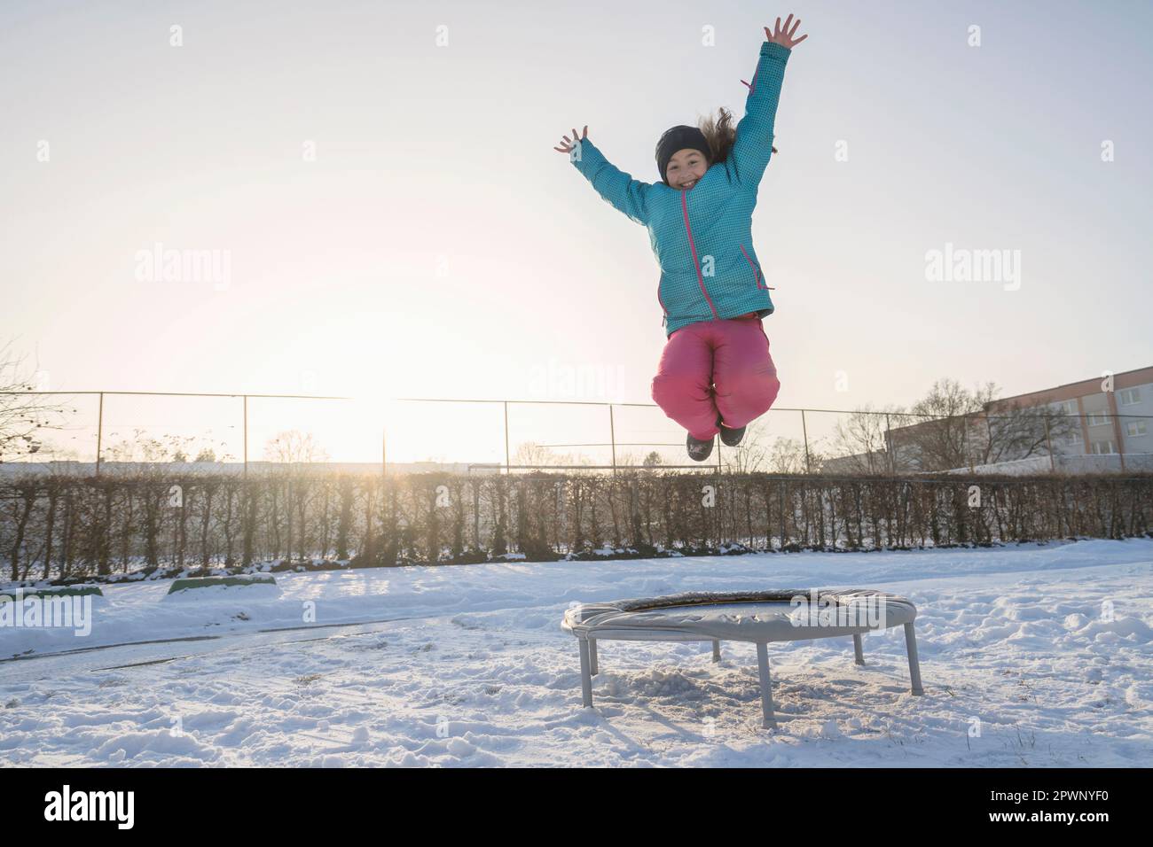 Child jumping on snow hi-res stock photography and images - Alamy