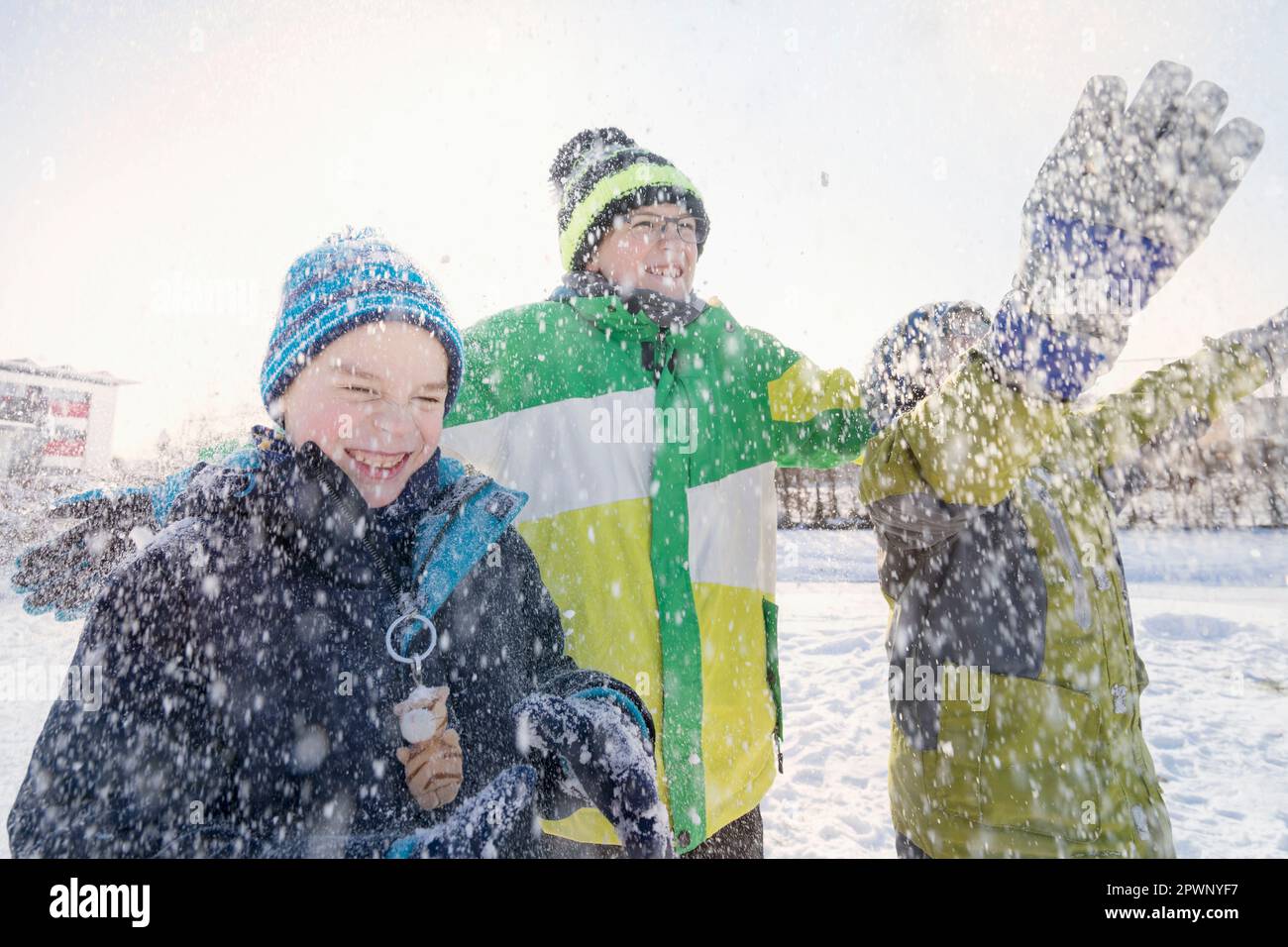 Children playing on snow field Stock Photo - Alamy