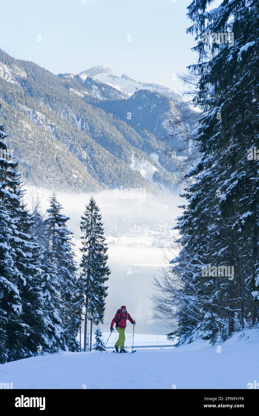 Skier walking on snow mountain Stock Photo - Alamy