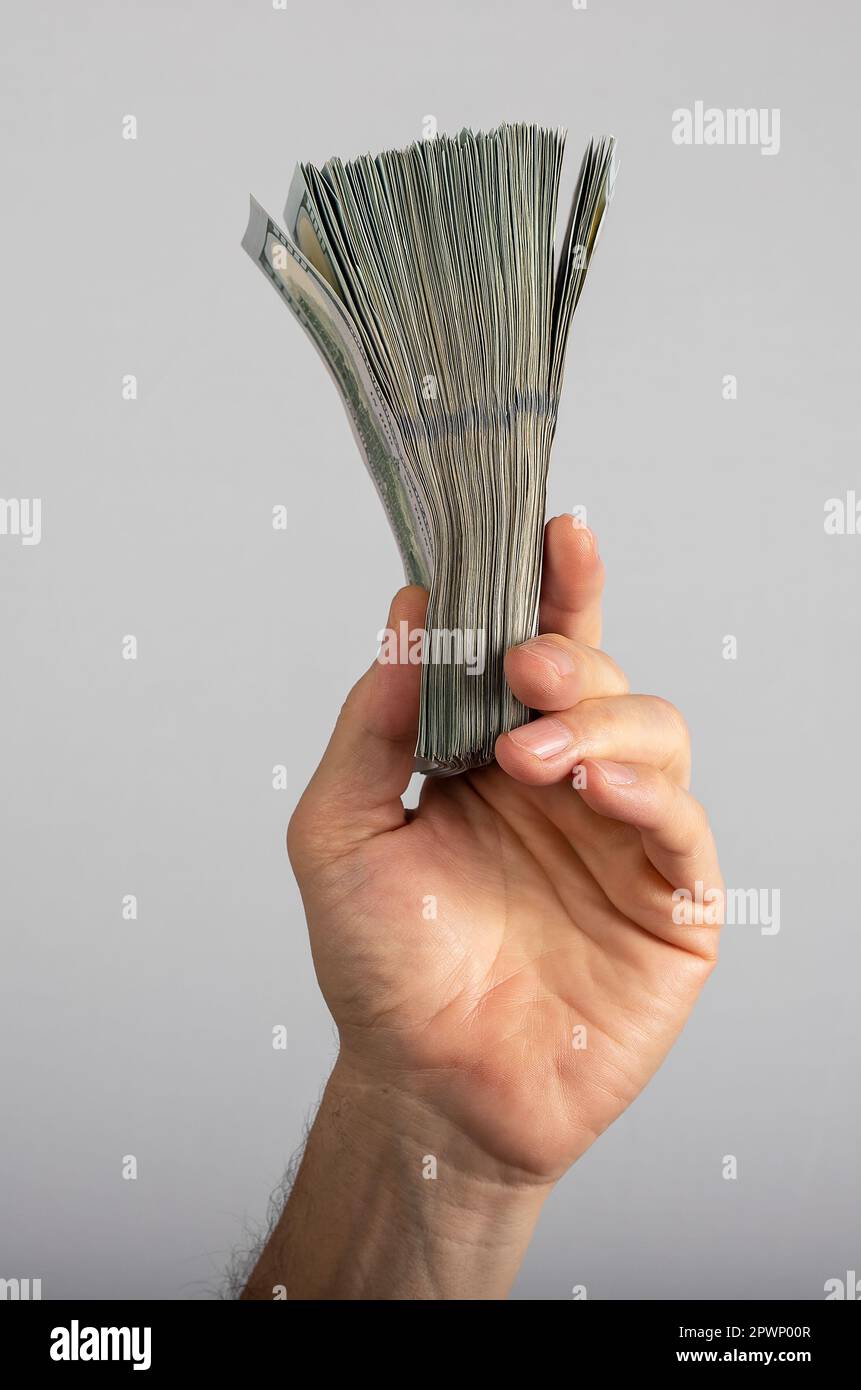 Hand holding dollar bills stack, money, bank notes, us banknotes Stock ...