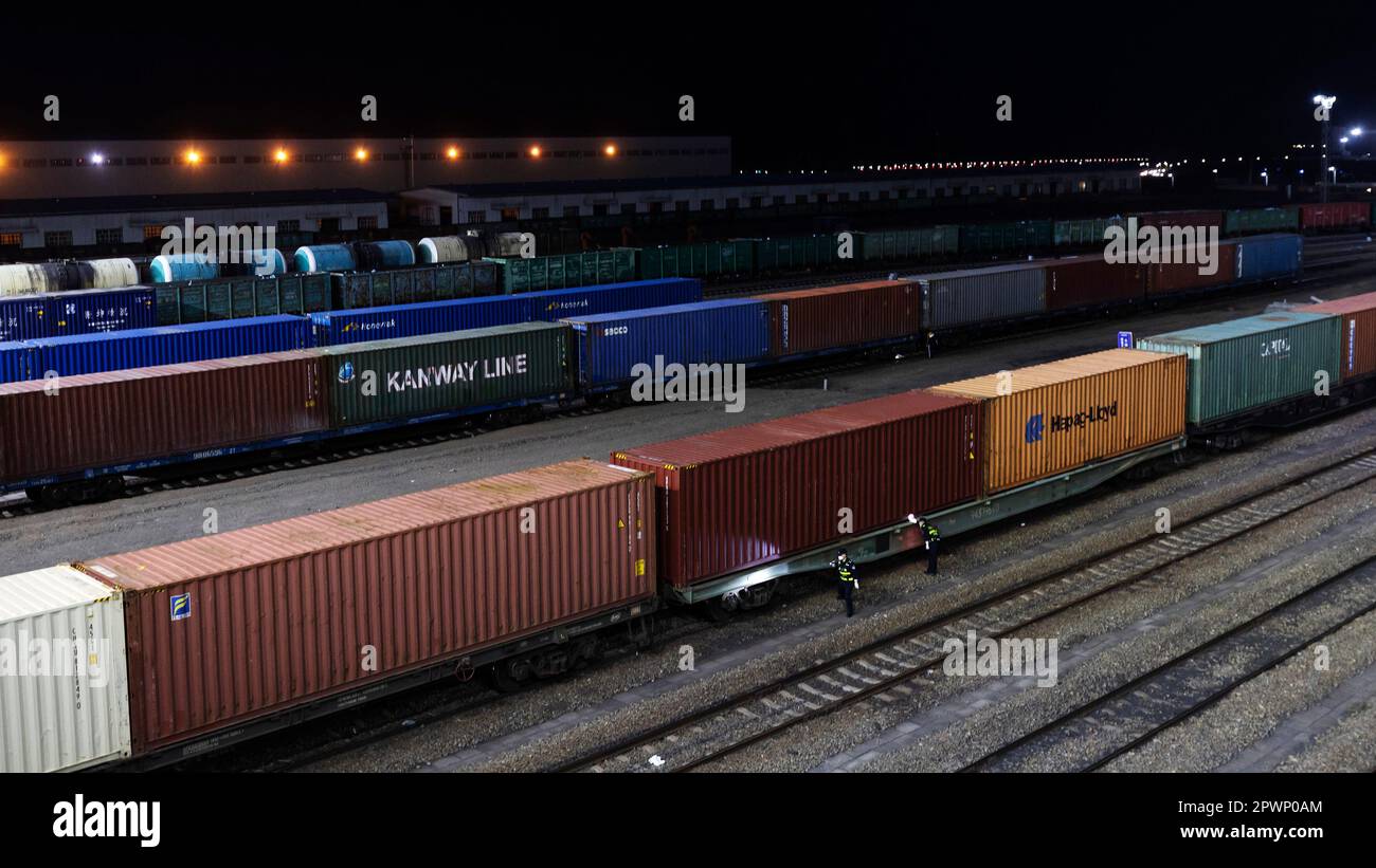 (230501) -- ALATAW PASS, May 1, 2023 (Xinhua) -- Cui Hongwu (L) and his ...