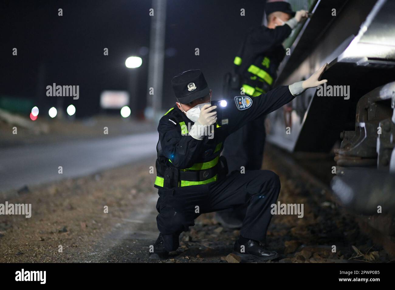 (230501) -- ALATAW PASS, May 1, 2023 (Xinhua) -- Cui Hongwu (front) and ...