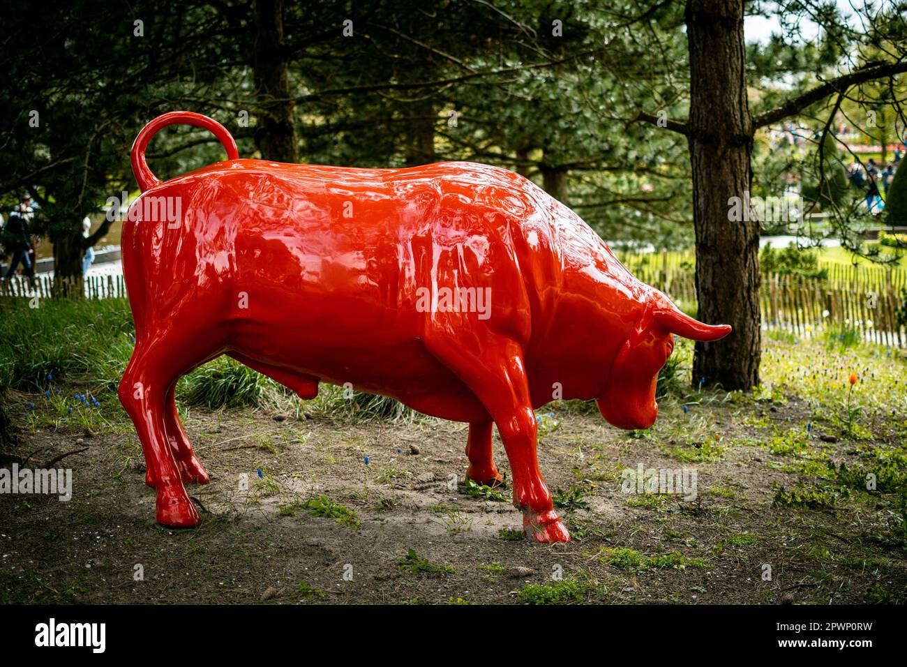 An artificial red bull standing in a divine green forest Stock Photo ...