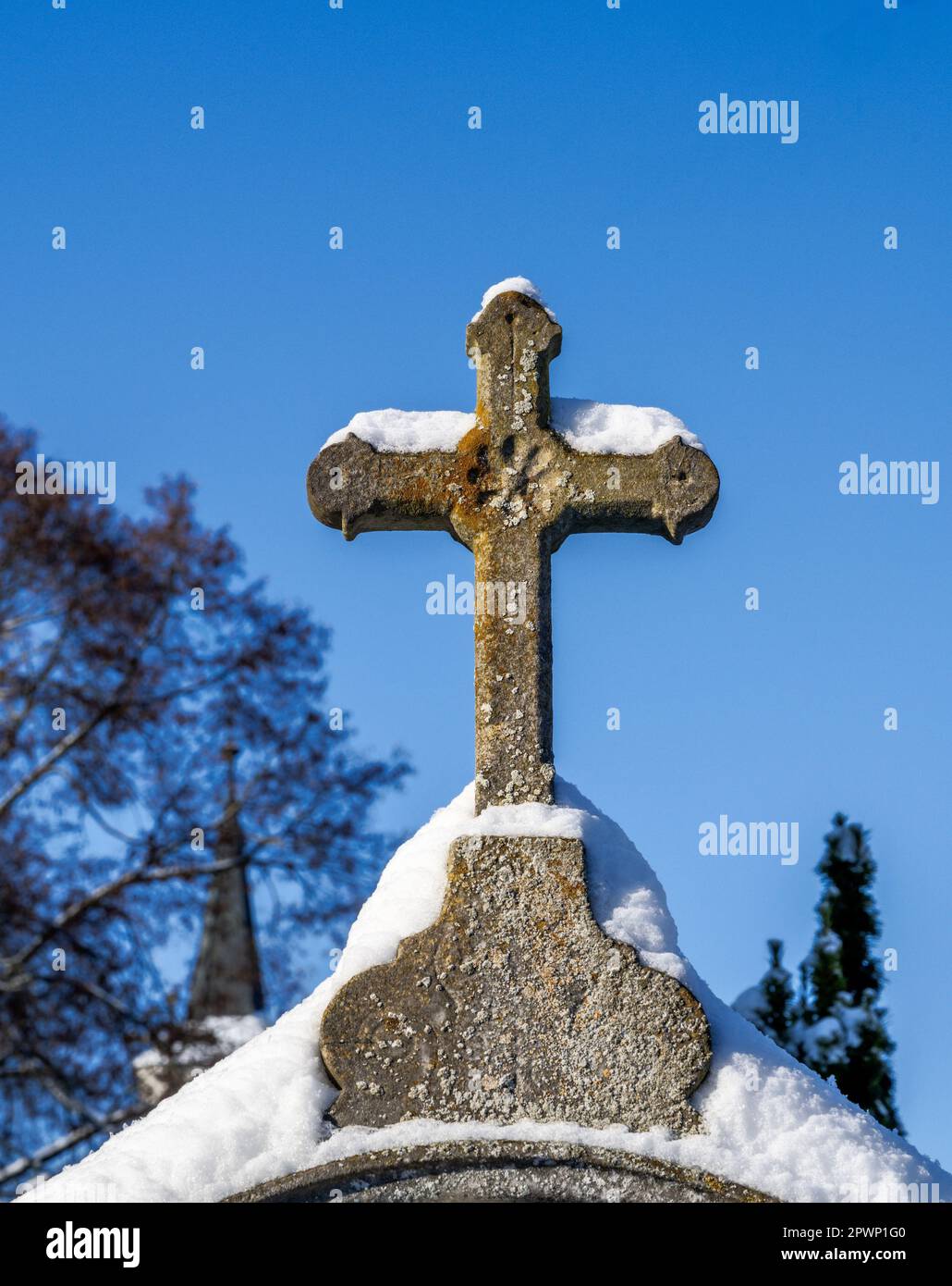 Snow covered historic crucifix in a cemetry Stock Photo - Alamy