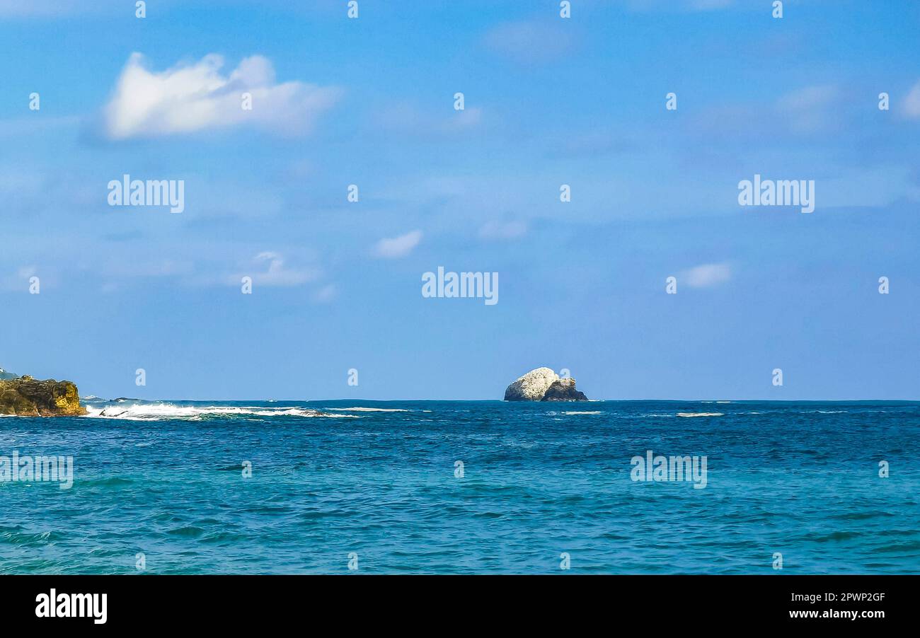 Beautiful paradise beach with mountains cliffs rocks high waves and ...