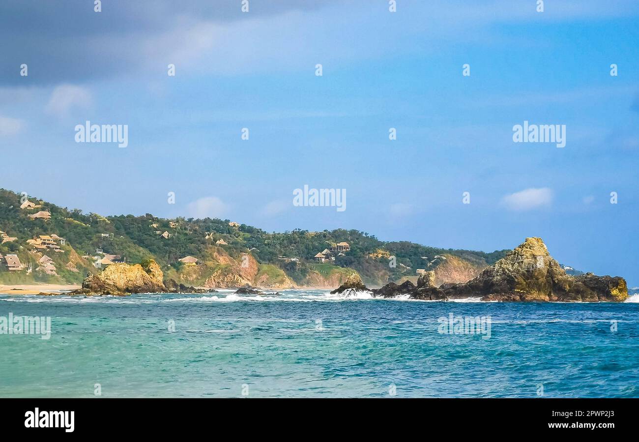 Beautiful paradise beach with mountains cliffs rocks high waves and ...