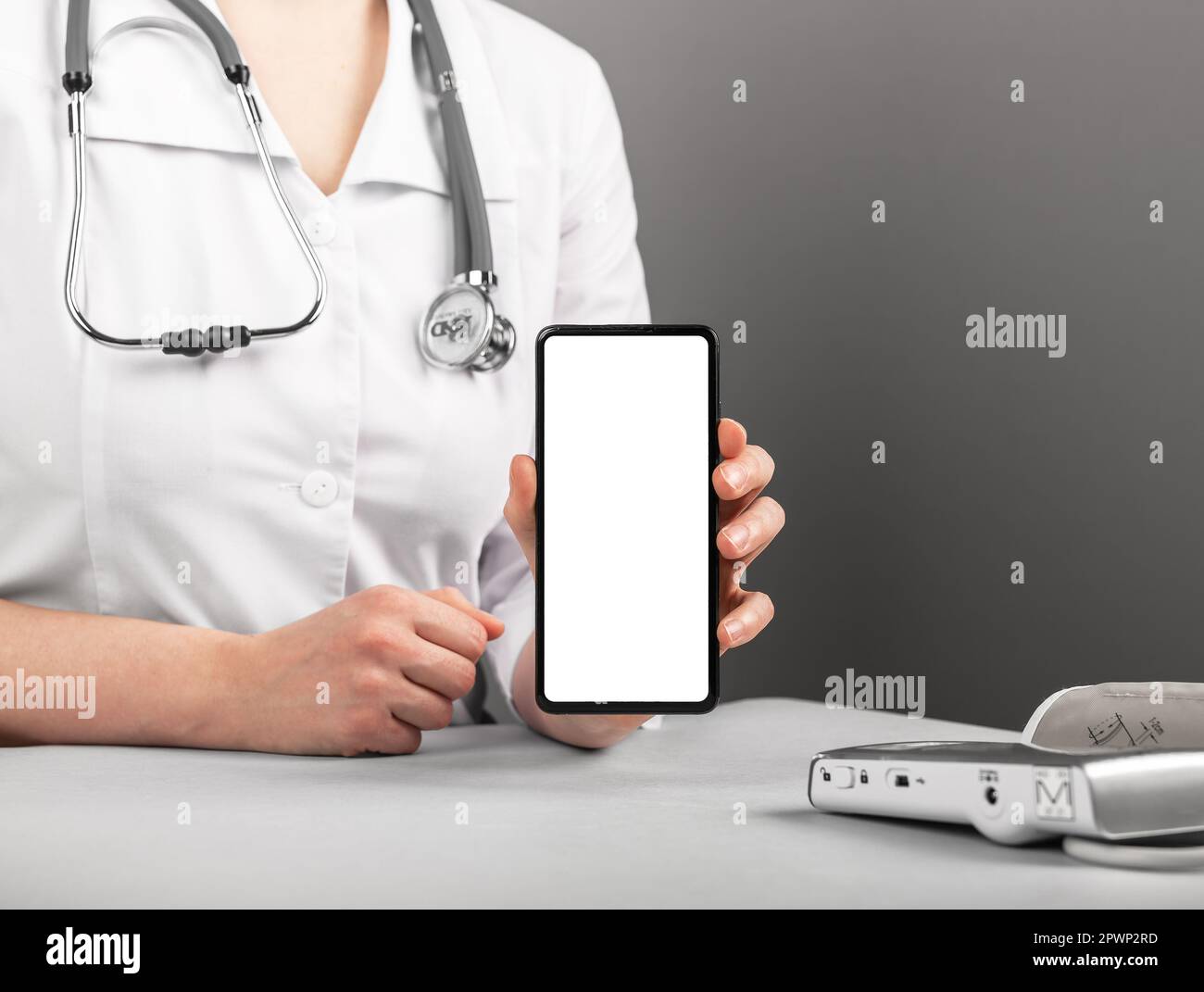 Doctor showing mobile screen in hand hi-res stock photography and ...