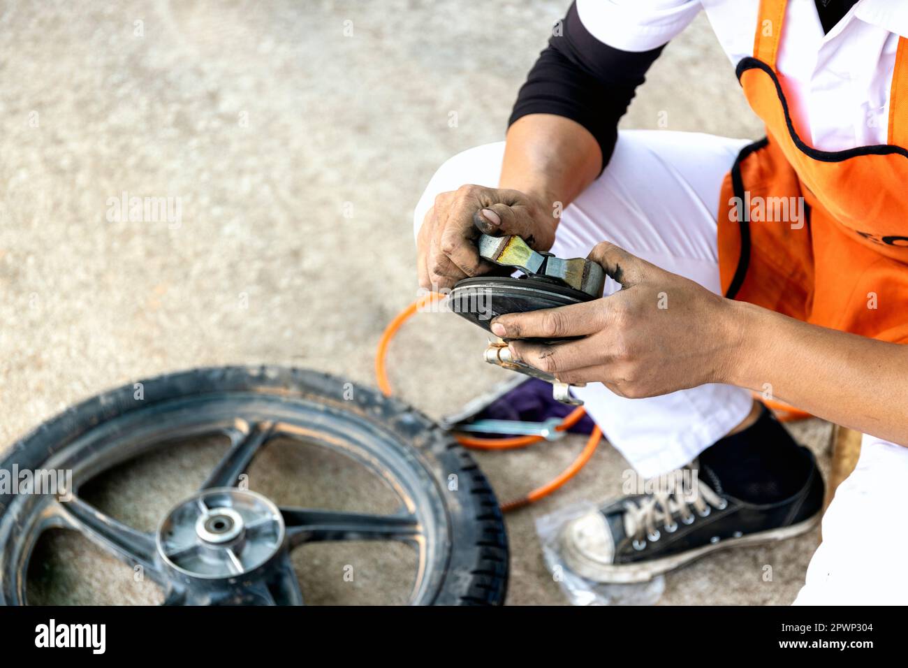 Mechanic replace adjust motorcycle rear hi-res stock photography and ...