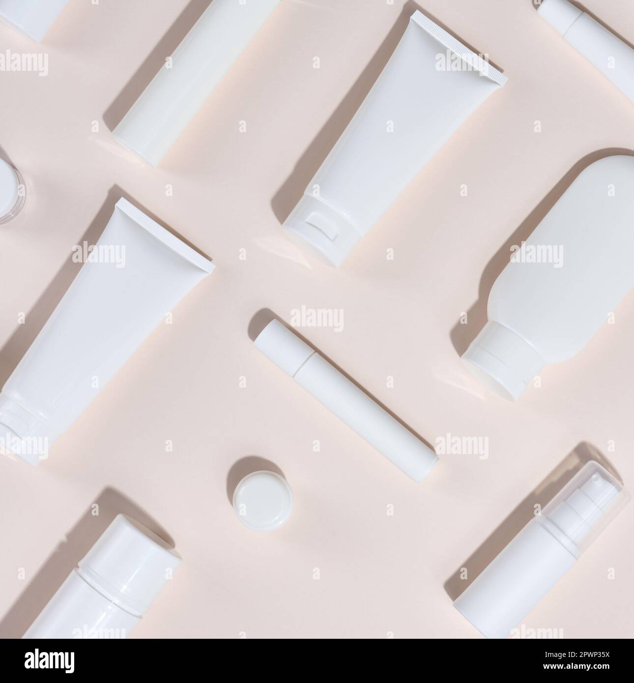 White plastic tubes, jars and other form of packaging for cosmetics on ...