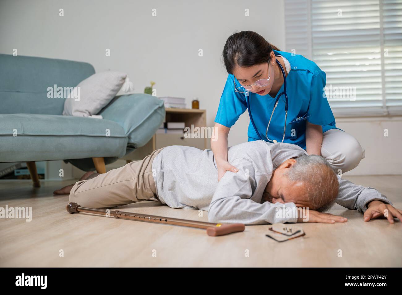 Disabled elderly old man patient with walking stick fall on floor and ...