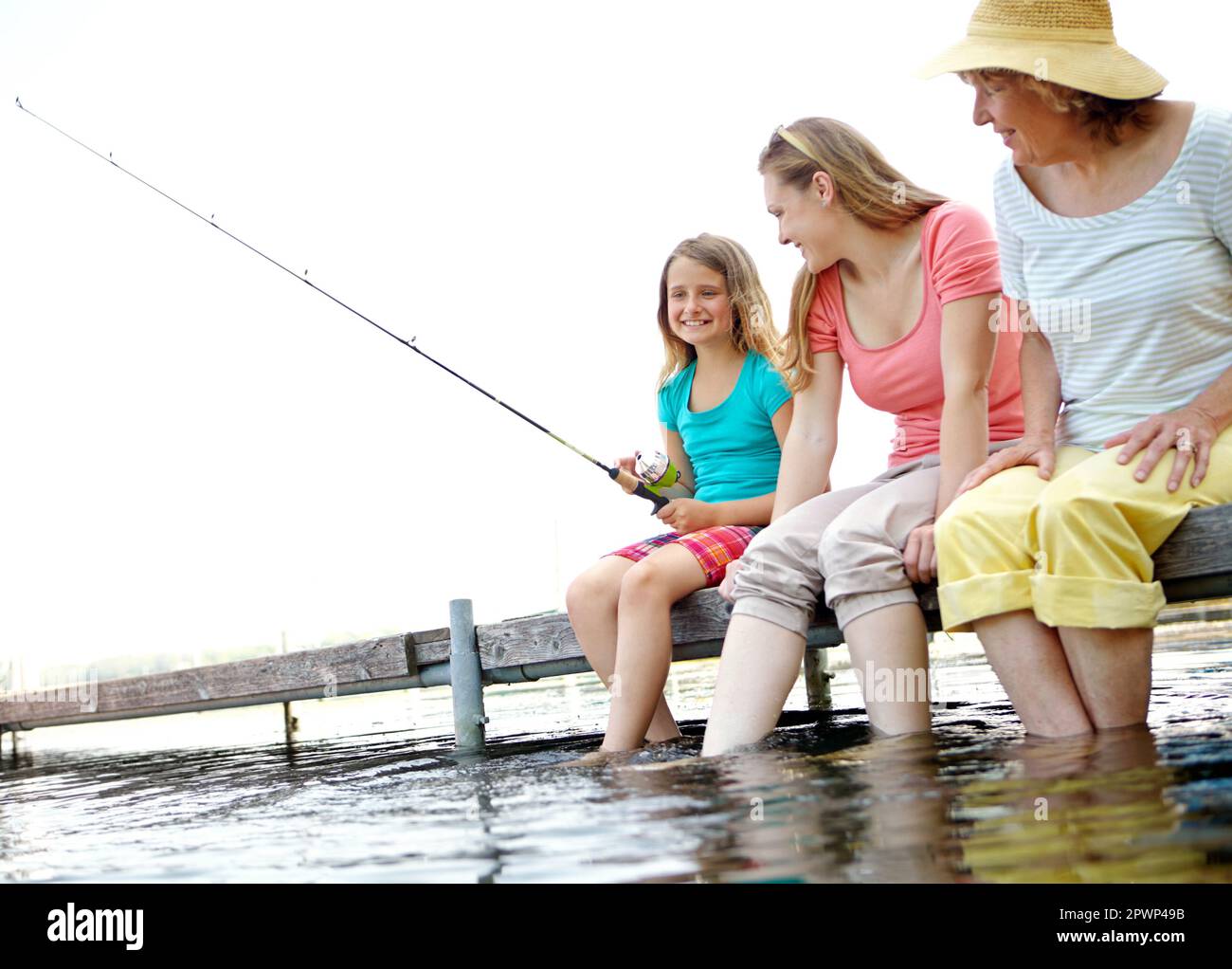 Im going to catch me a huge one. A little girl fishing with her ...