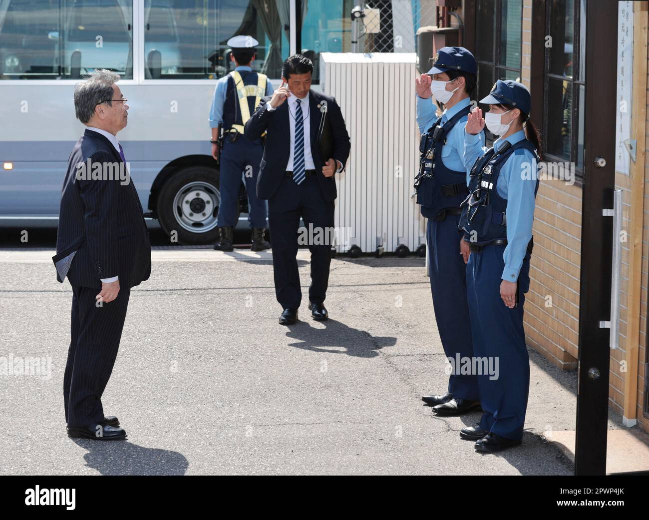 Chairperson of the National Public Safety Commission Koichi Tani (L ...
