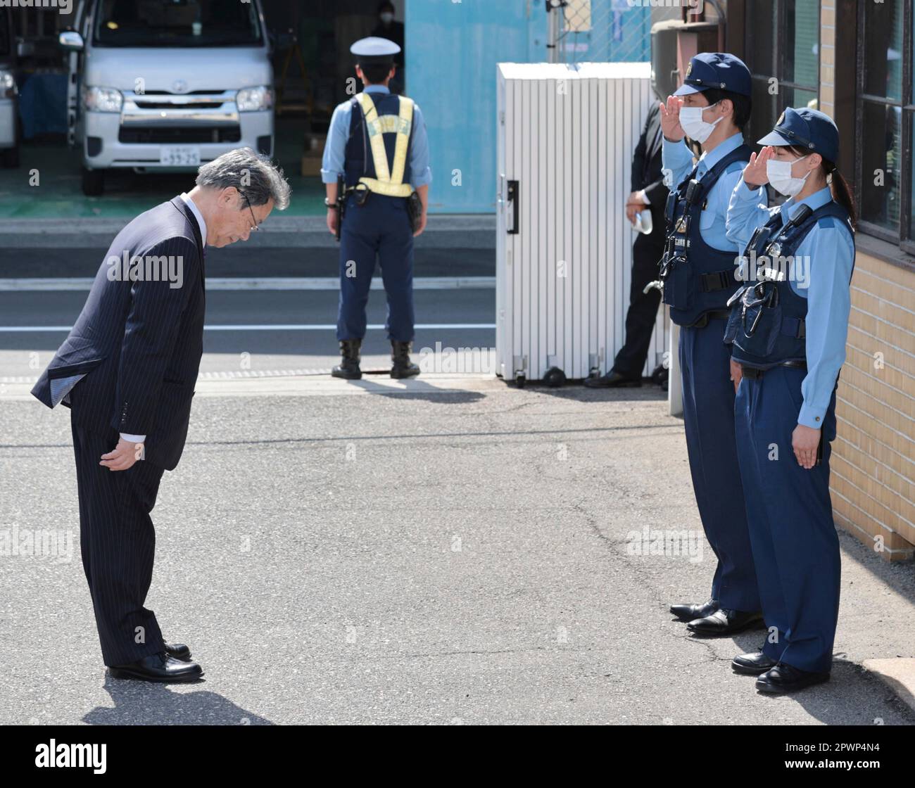 Chairperson of the National Public Safety Commission Koichi Tani (L ...
