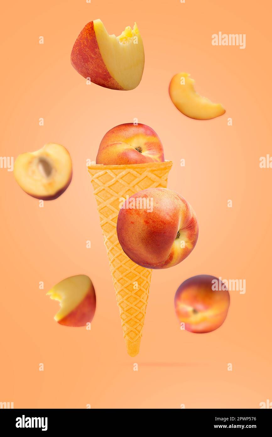Falling ice cream cone with peach fruits. Seven flying whole peaches on ...