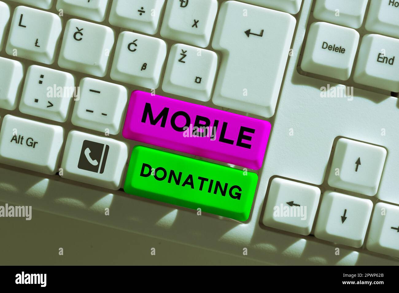 Hand writing sign Mobile Donating, Word Written on to give something to a charity or any cause ...