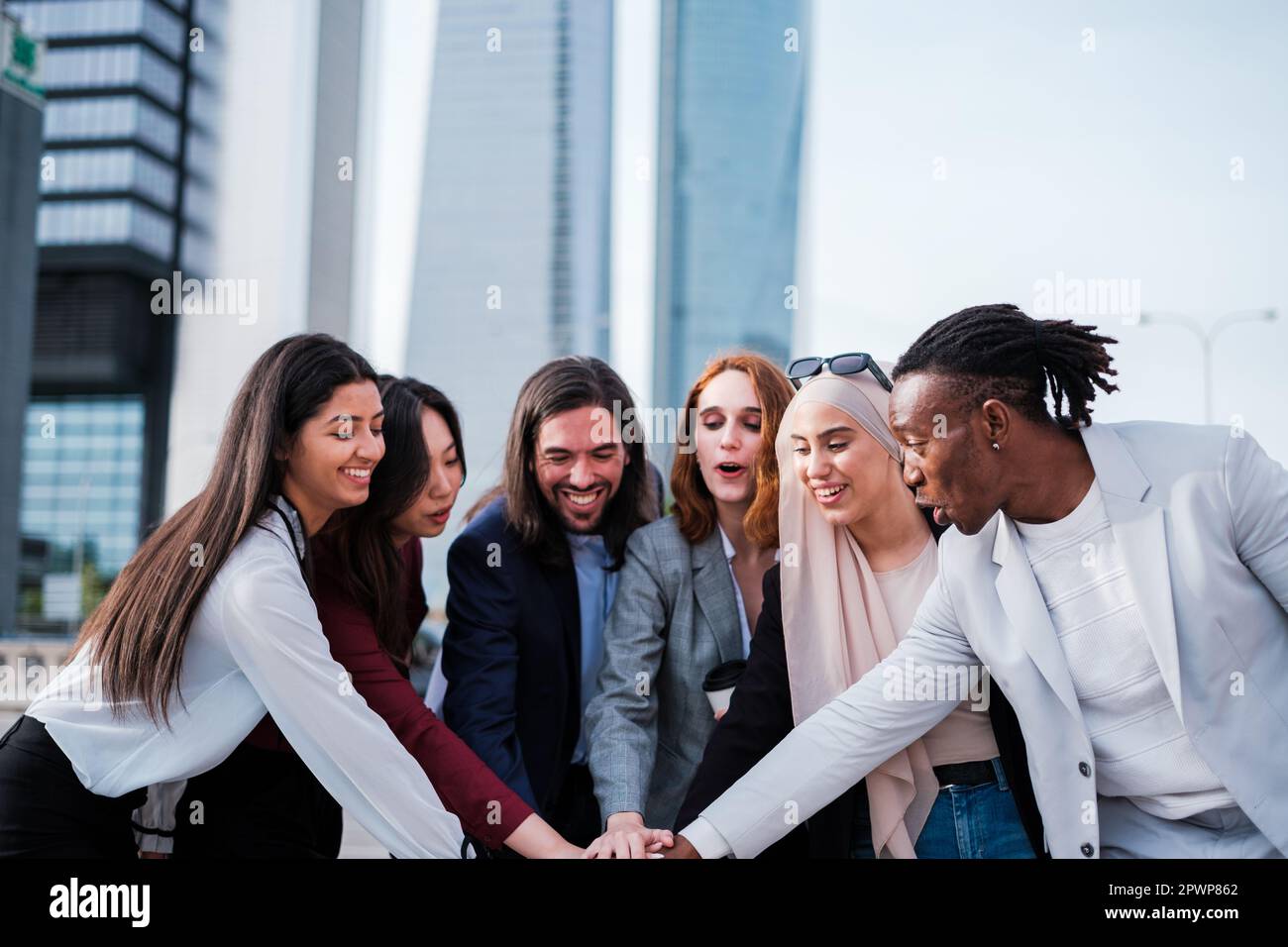 Group of workers gathered to celebrate the good result of teamwork well ...
