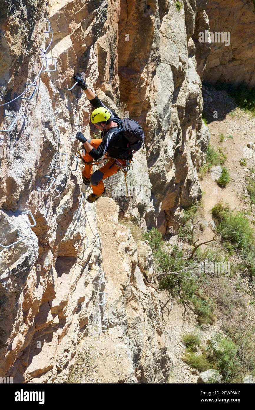 Climbing a ferrata route in San Blas, Arquillo reservoir in Teruel ...