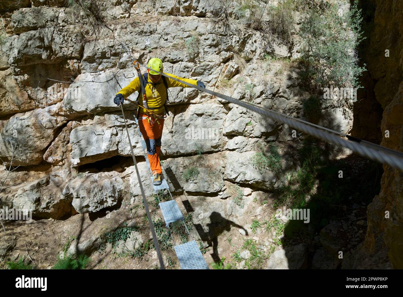 Climbing a ferrata route in San Blas, Arquillo reservoir in Teruel ...