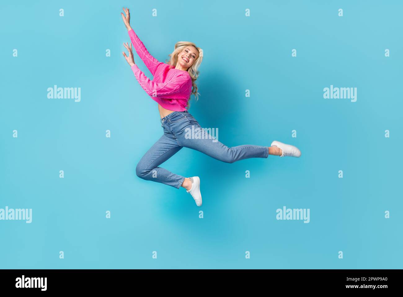 Full length cadre of funky positive girl jumping graceful ballerina ...