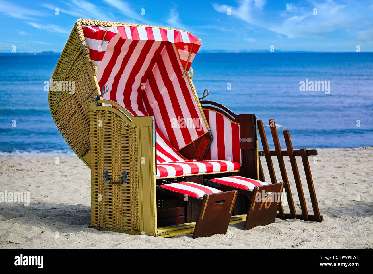 Beach chairs on Timmendorfer Strand on the Baltic sea with blue sky ...