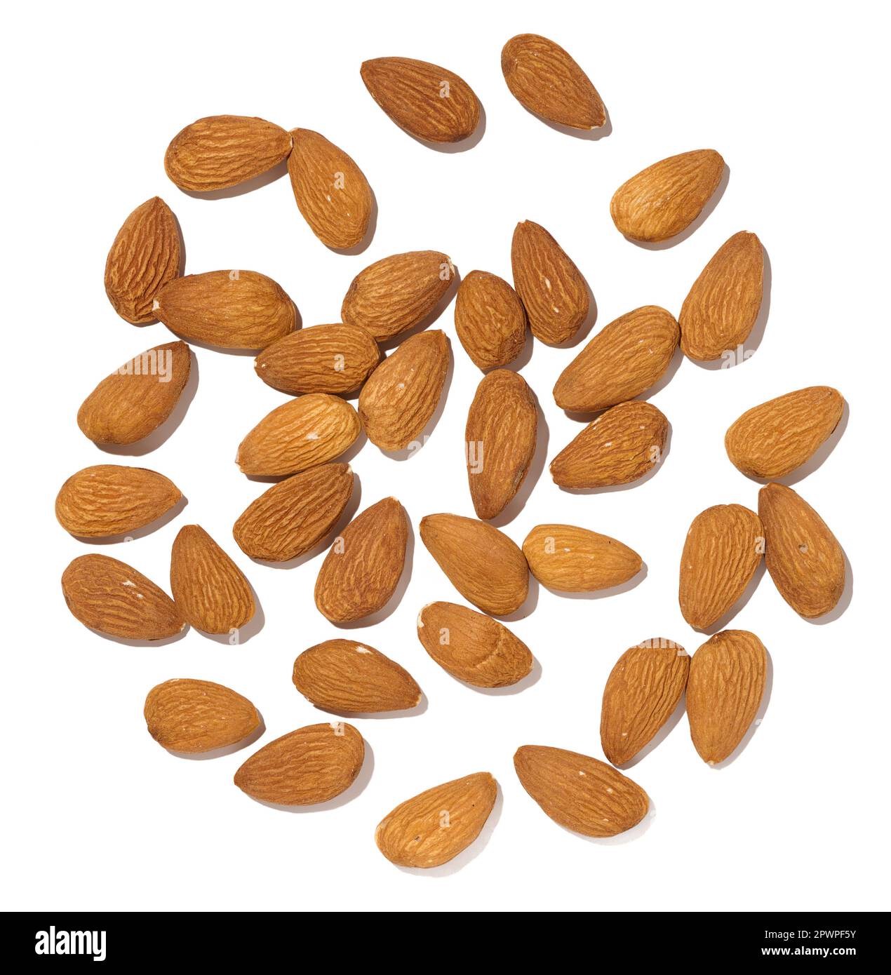 Almond kernel on a white isolated background, top view Stock Photo - Alamy