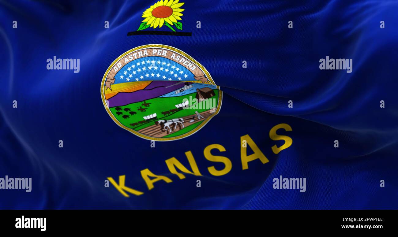 Close-up view of Kansas state flag waving in the wind. Kansas is a ...