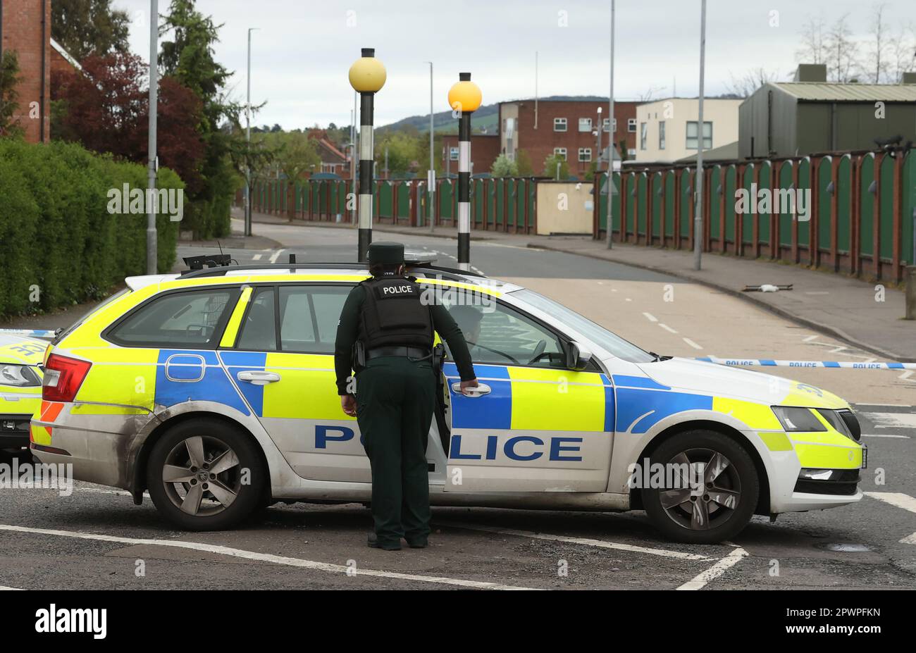A PSNI officer on Ladas Drive in Belfast as a man has been arrested ...