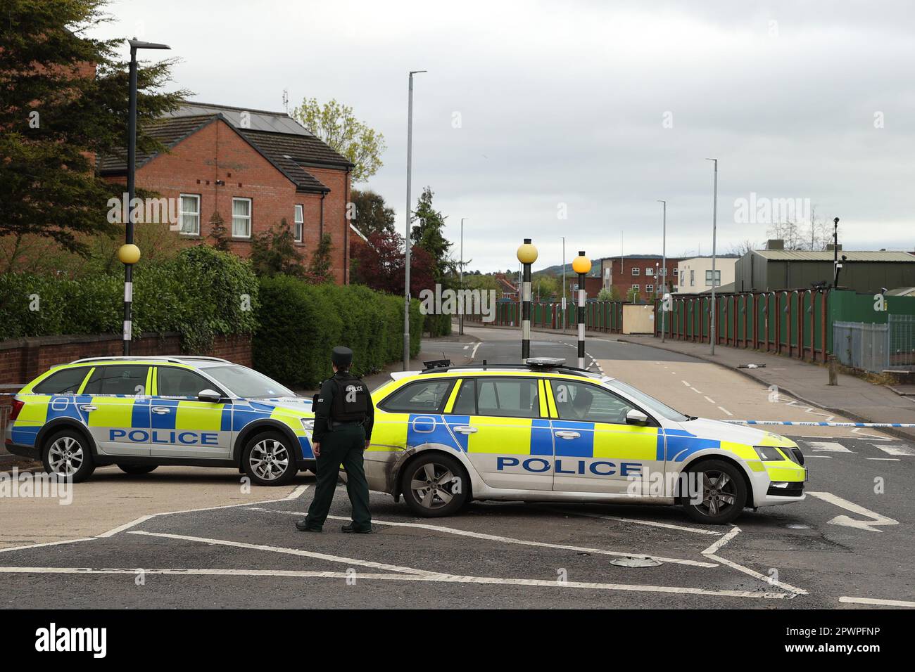 A PSNI officer on Ladas Drive in Belfast as a man has been arrested ...