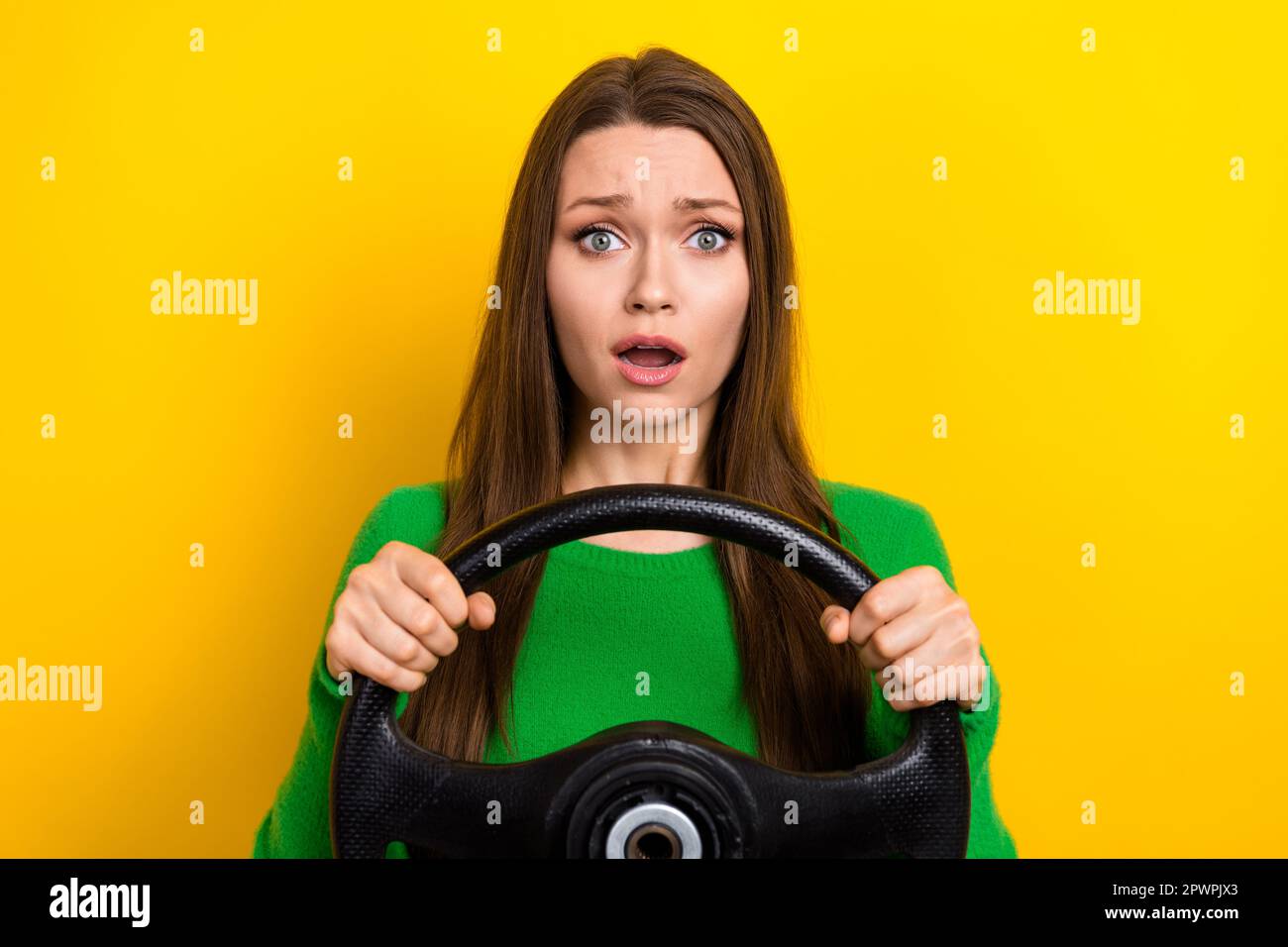 Photo of impressed scared woman wear green sweater driving automobile ...