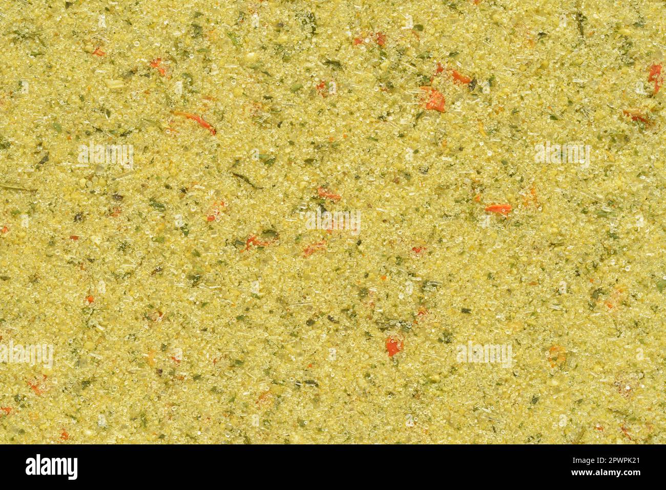 Yellow chicken stock powder condiment texture or background Stock Photo ...