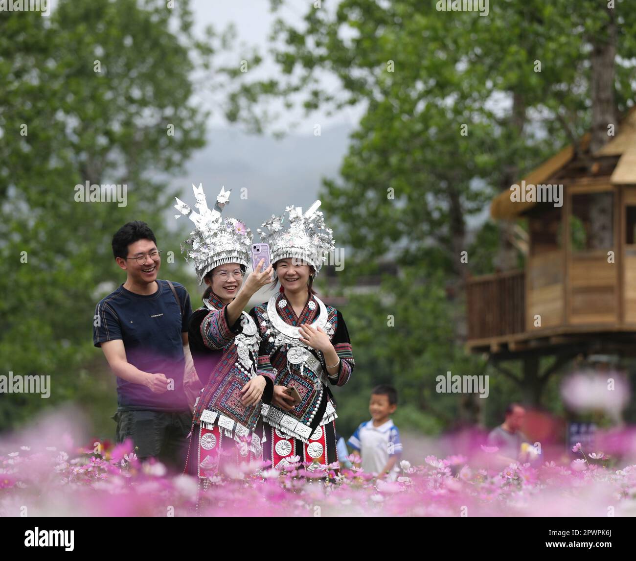 Rongjiang, China's Guizhou Province. 30th Apr, 2023. Tourists wearing ...
